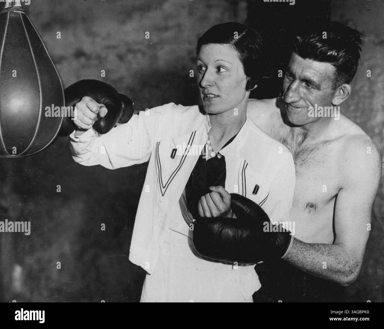Photo Shows: Al Burke introduces his fiancee to the art of Boxing. Al ...