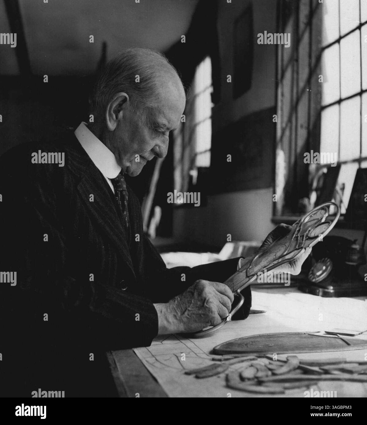 Mr. Samuel Caldwell, 93, at work on a stained glass window from ...