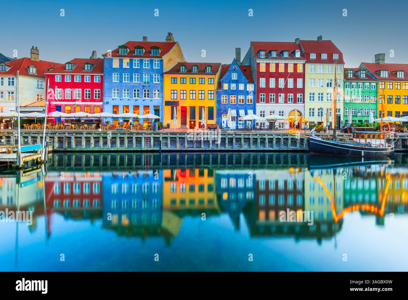 Copenhagen, Denmark. Nyhavn, water canal reflections in the morning ...
