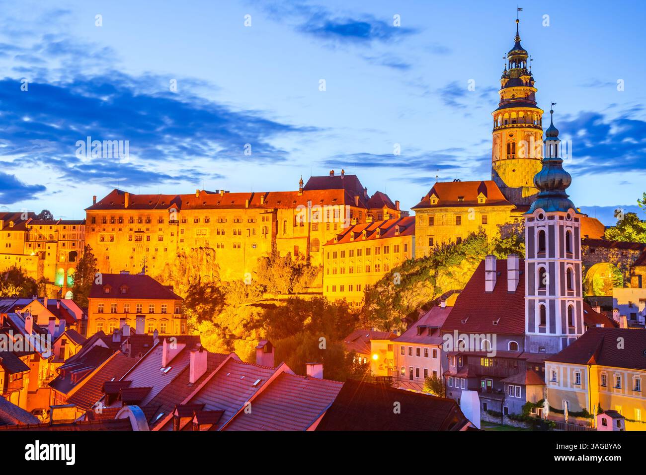 Cesky Krumlov, Czech Republic. Twilight glows with golden lights, its ...