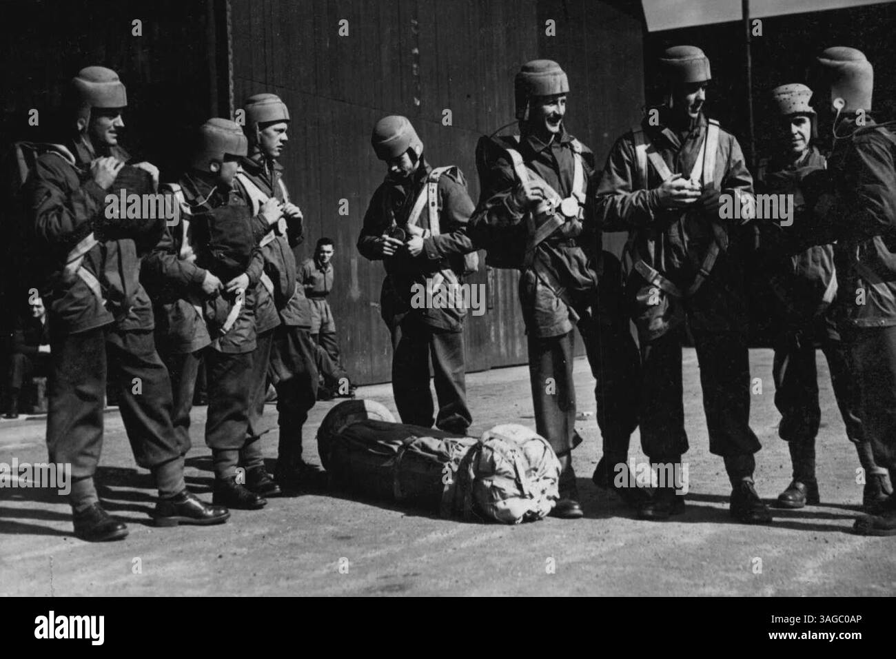 Paratroops Prepare -- Paratroops fasten up their kit ready for ...