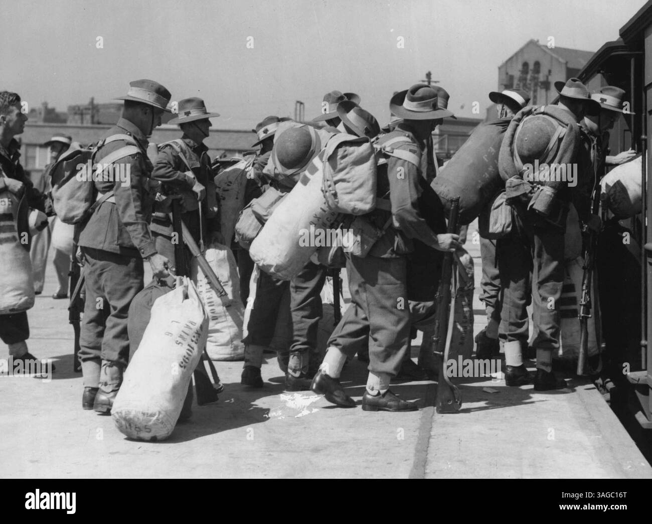 Queensland members of the 9th Australian Division returning from the ...