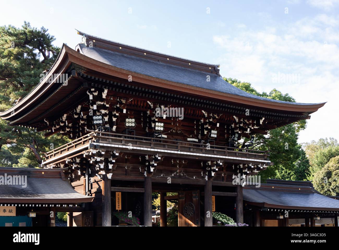 Grand entrance gate at Meiji Shrine in Tokyo features a sweeping tiled ...