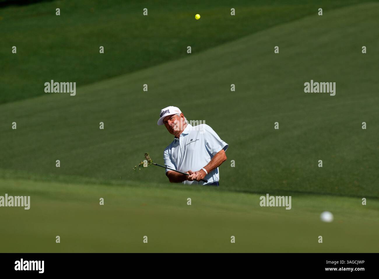 Fred Couples hits from the bunker on the 10th green during a practice ...