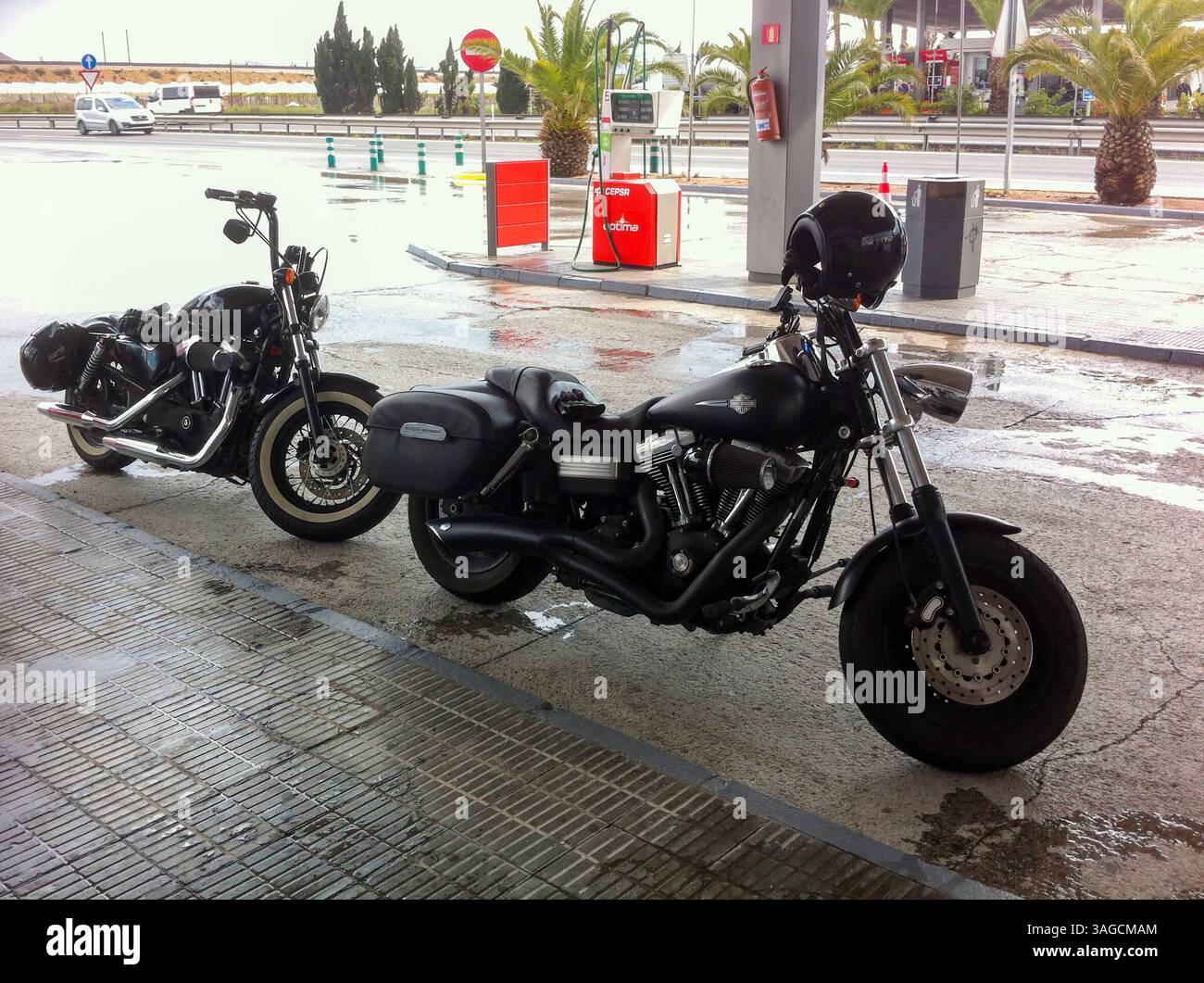 Two Harley Davidson motorcycles at a petrol station Stock Photo - Alamy
