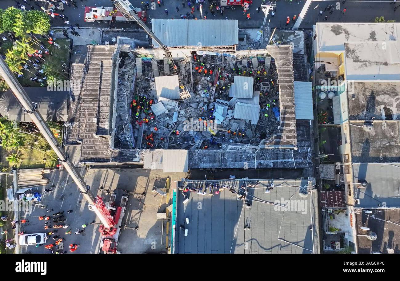 Rescue workers search for survivors at the Jet Set nightclub after its ...