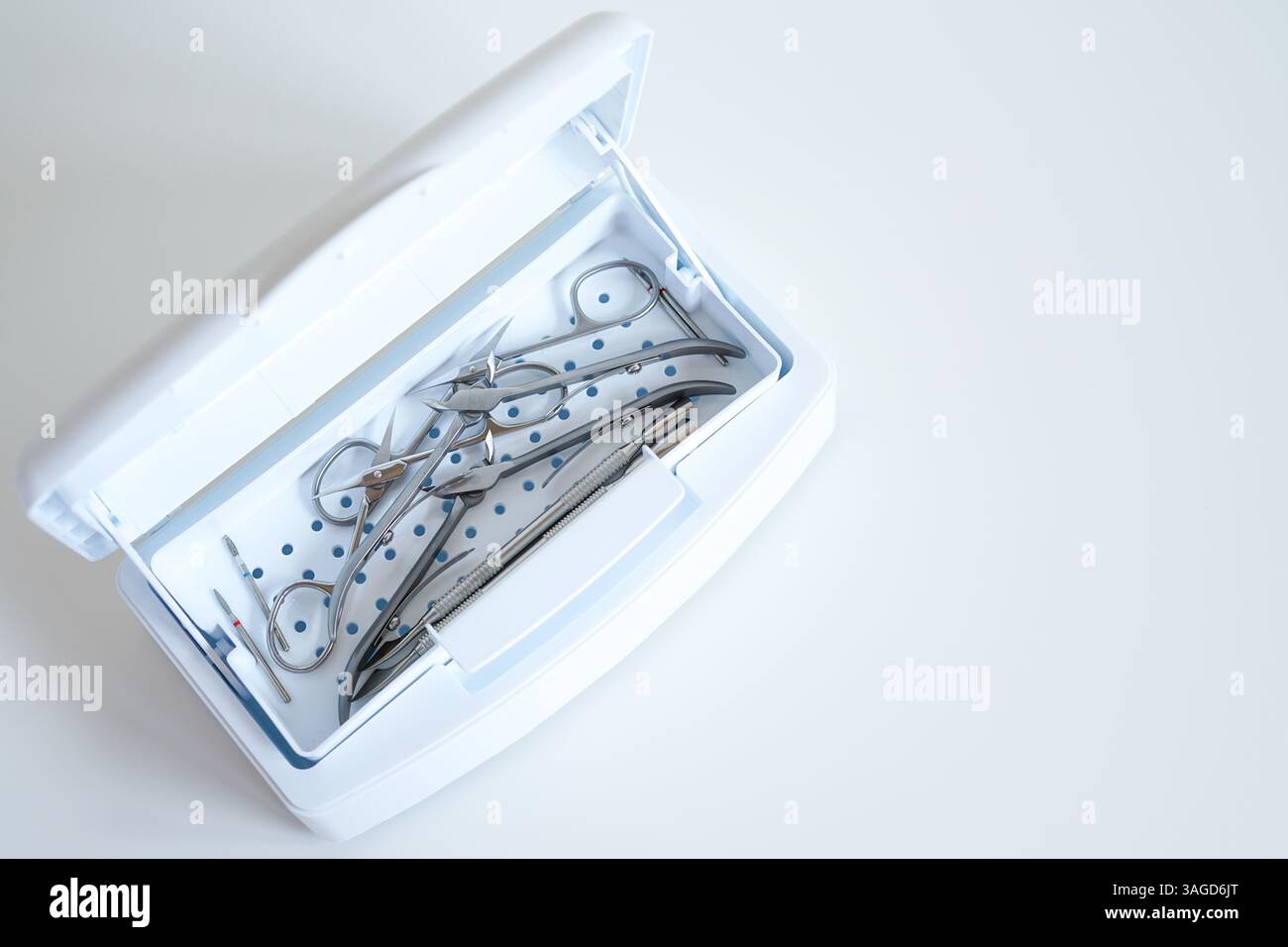 Cleaning and disinfecting manicure tools in a sterilizer for safe use ...