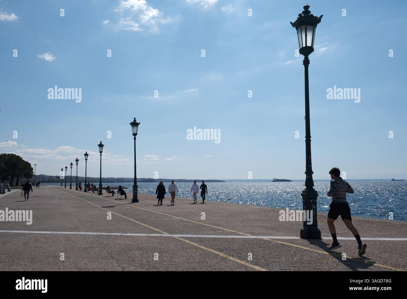 People relaxing on the Nea Paralia - Seaside Promenade in Thessaloniki ...
