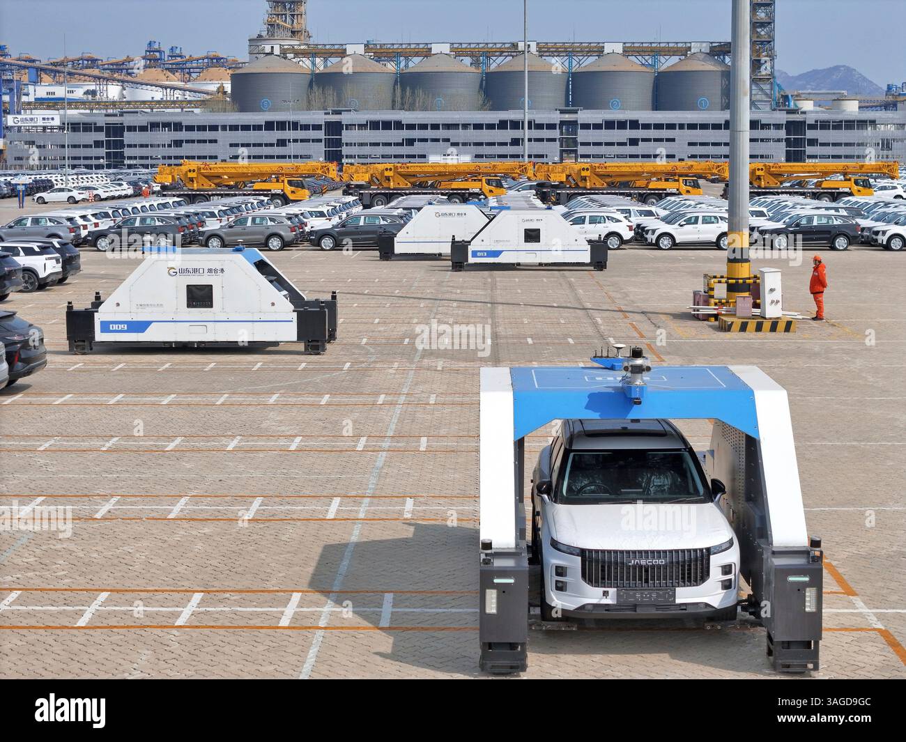 A car transporter carries a car in a parking space at the vehicle ...