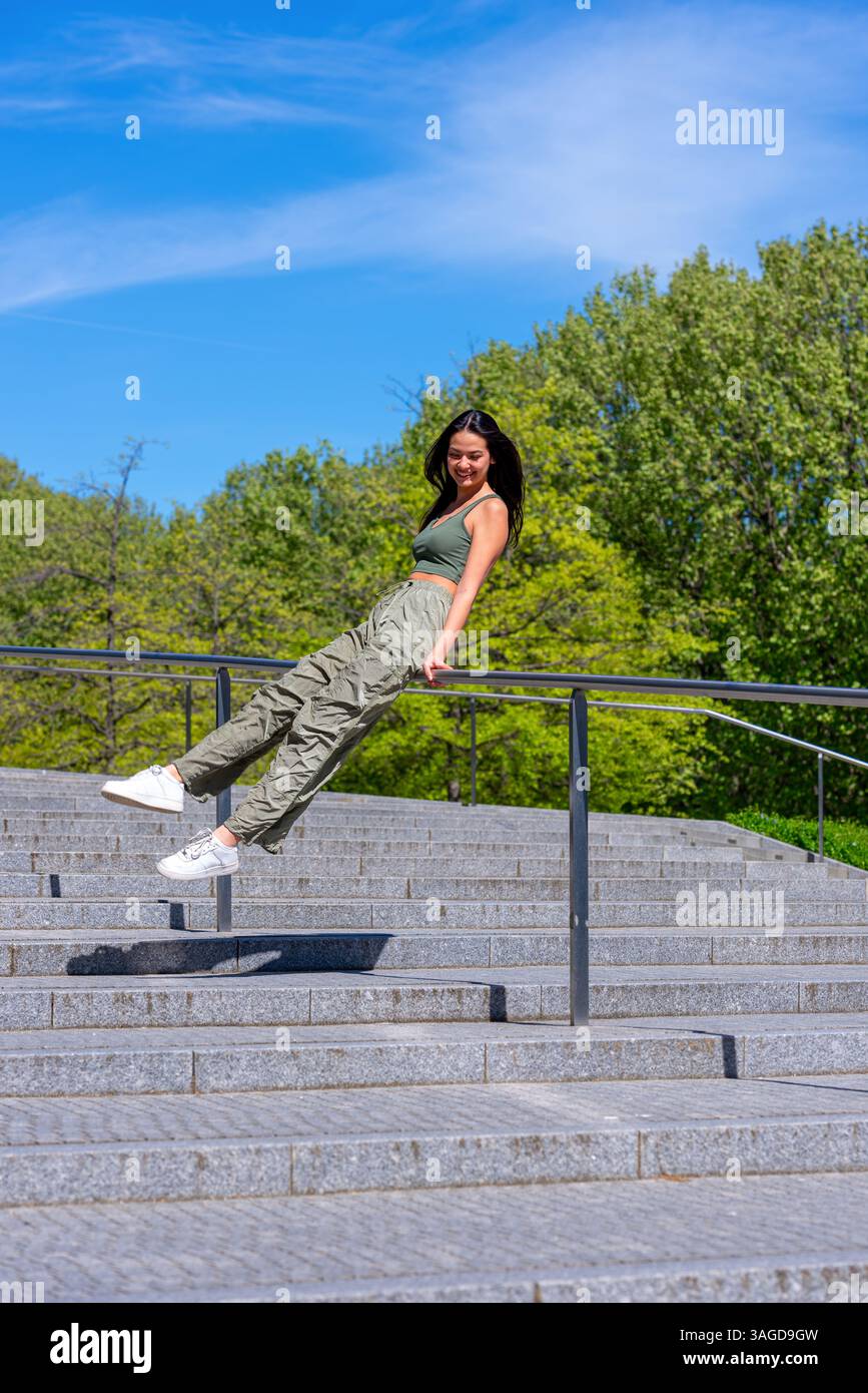 Beautiful Gen Z woman taking a break from city life and having fun in a ...