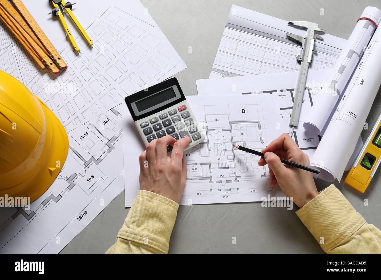 Architect working with project, top view. Different technical drawings ...