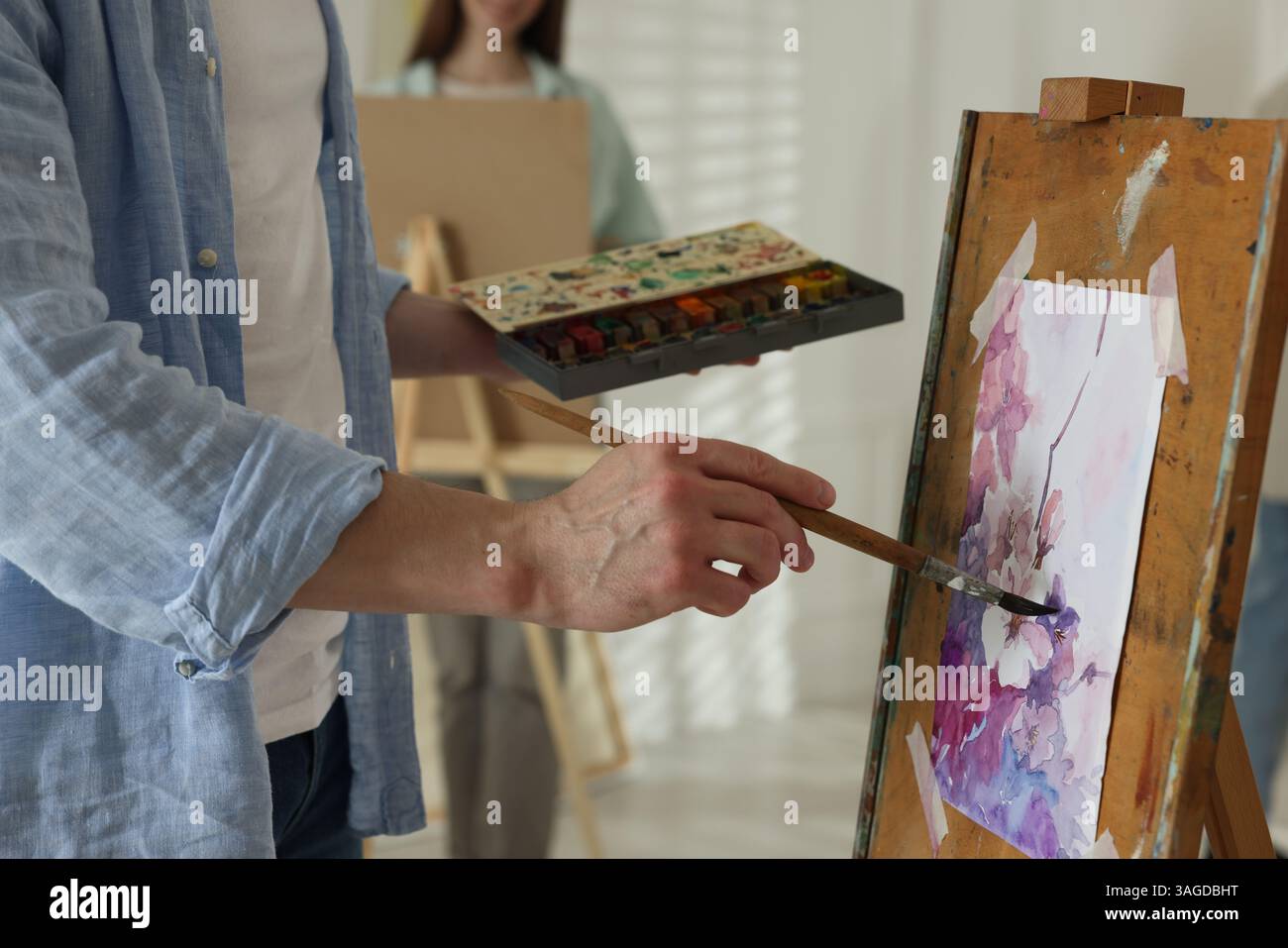 Male hand brush during painting hi-res stock photography and images - Alamy