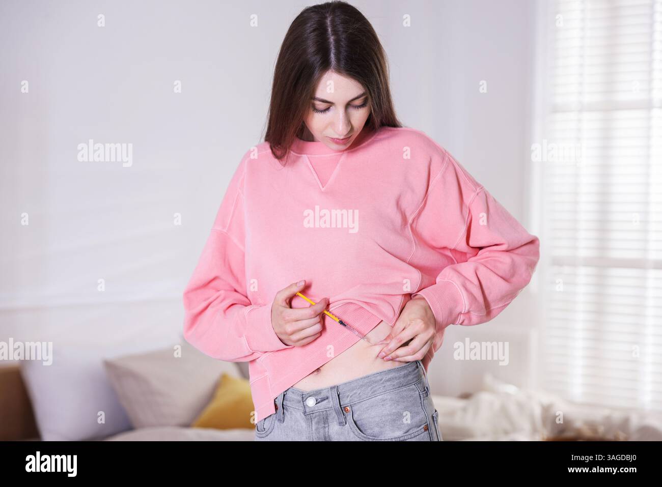 Woman making insulin injection into her stomach at home. Diabetes Stock ...