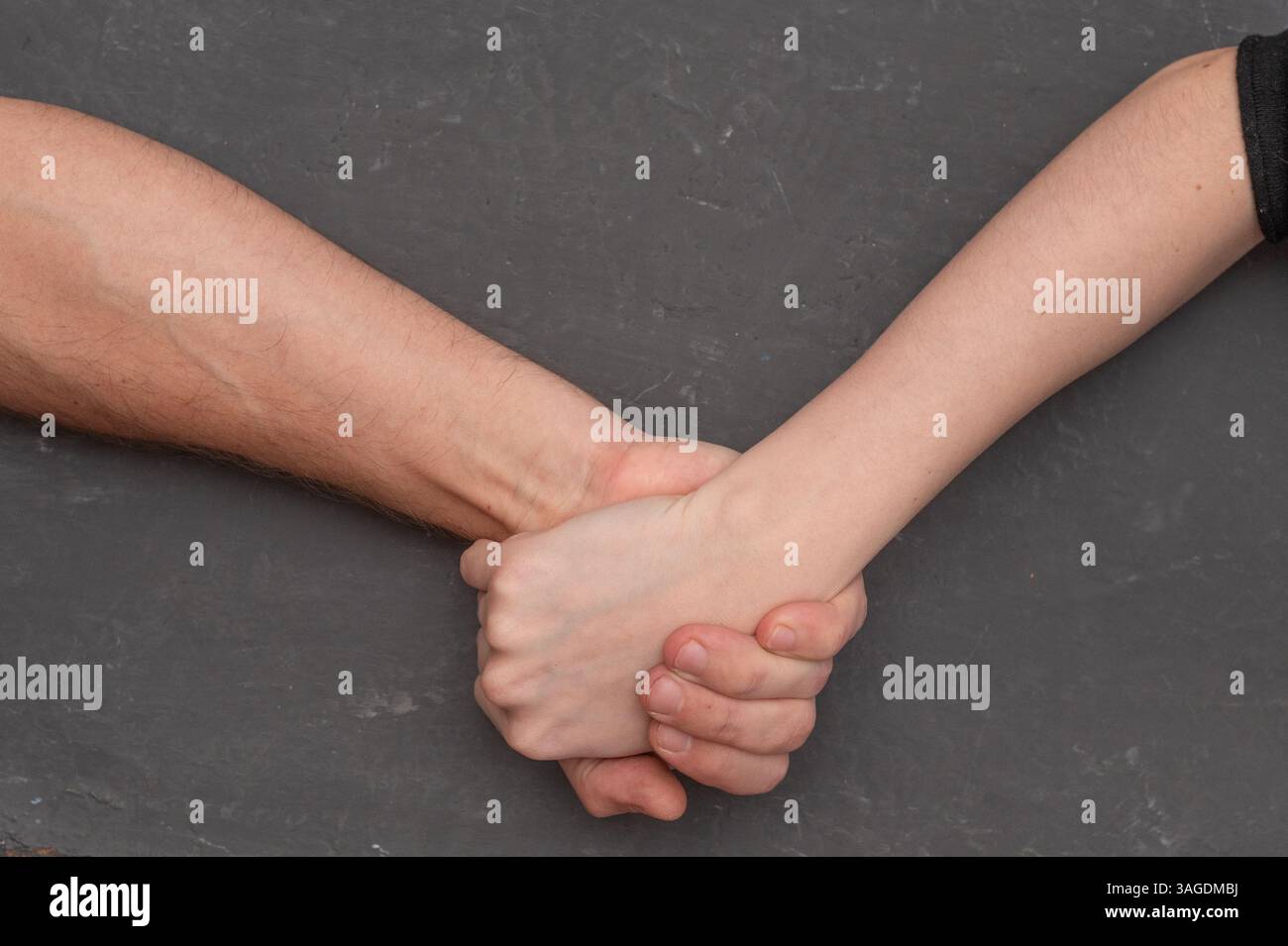 An arm wrestling challenge between a man and a woman. Female power ...
