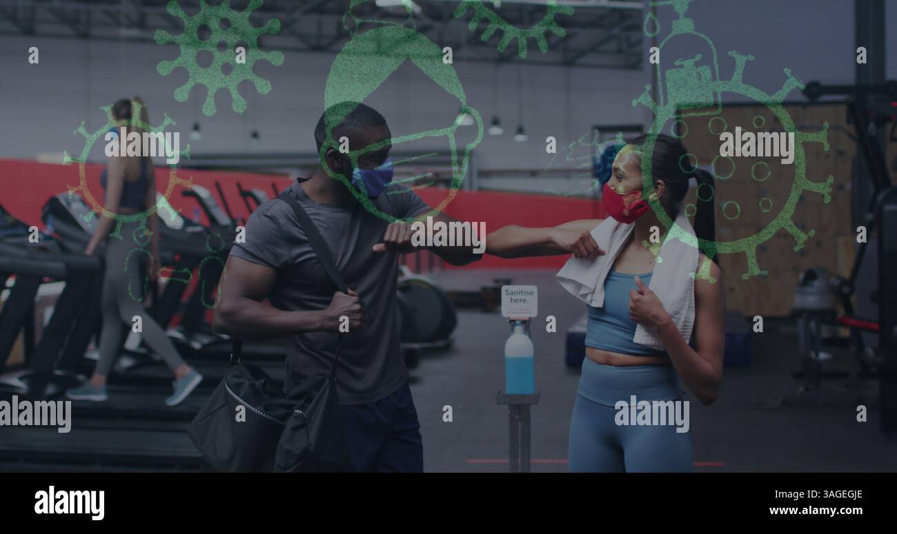 Image of covid-19 icons floating over diverse group wearing face masks ...