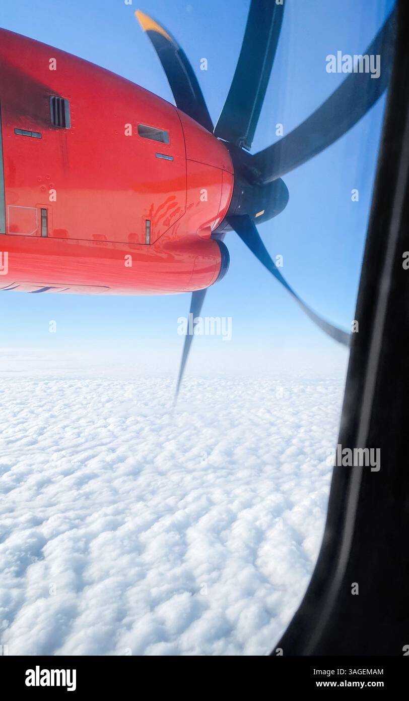 Flying above the clouds - window seat view. Close-up view of aircraft ...