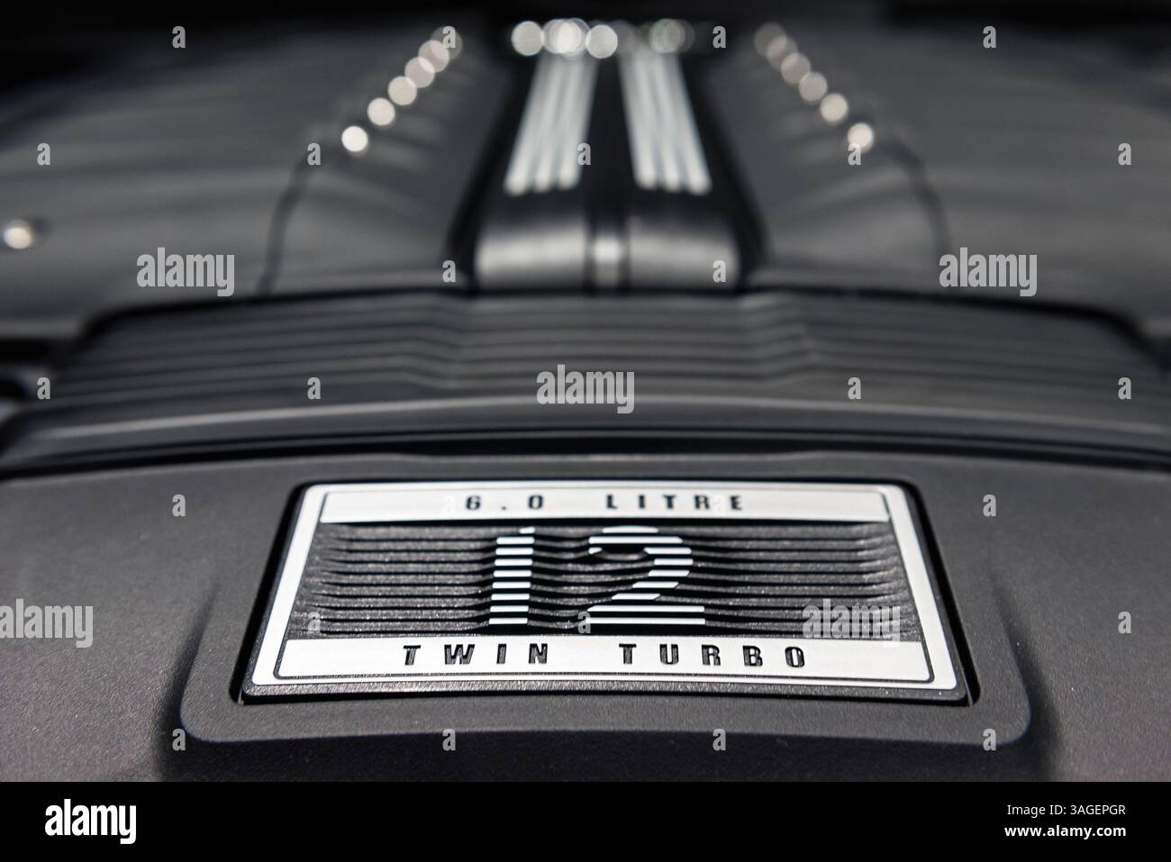 Plaque and engine cover of Bentley W12 that powers luxury cars. Plastic ...