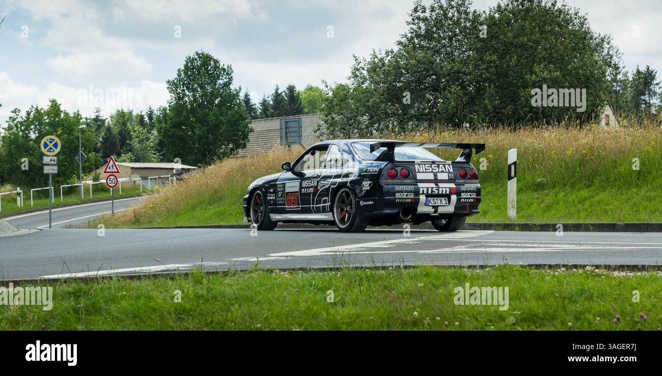 Trafiic in Nürburgring area: rare Nissan Skyline R33 GT-R approaching ...