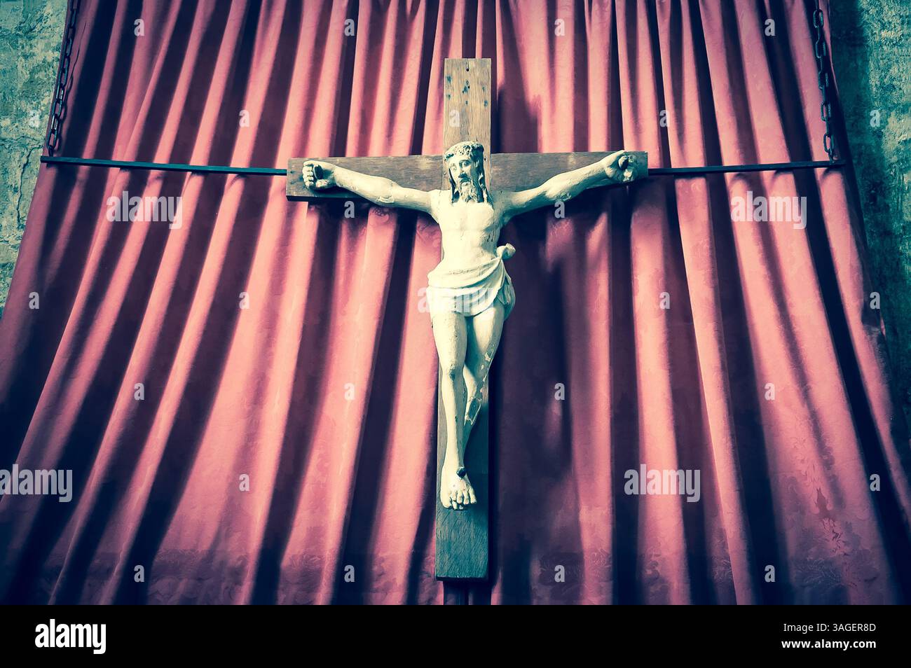 Old wooden crucifix of Jesus Christ isolated on drapery background in ...