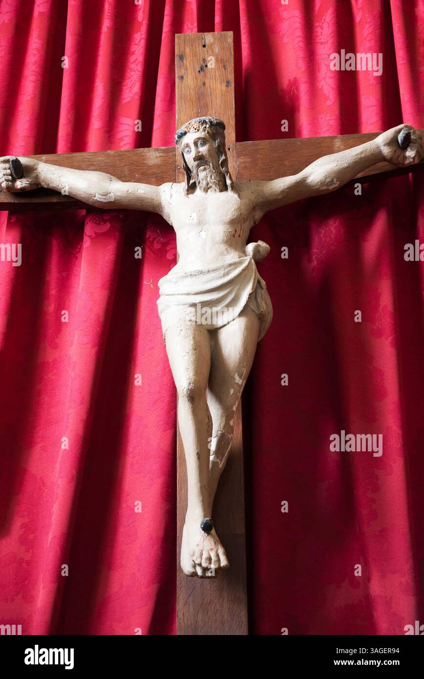 Old wooden crucifix of Jesus Christ isolated on drapery background in ...