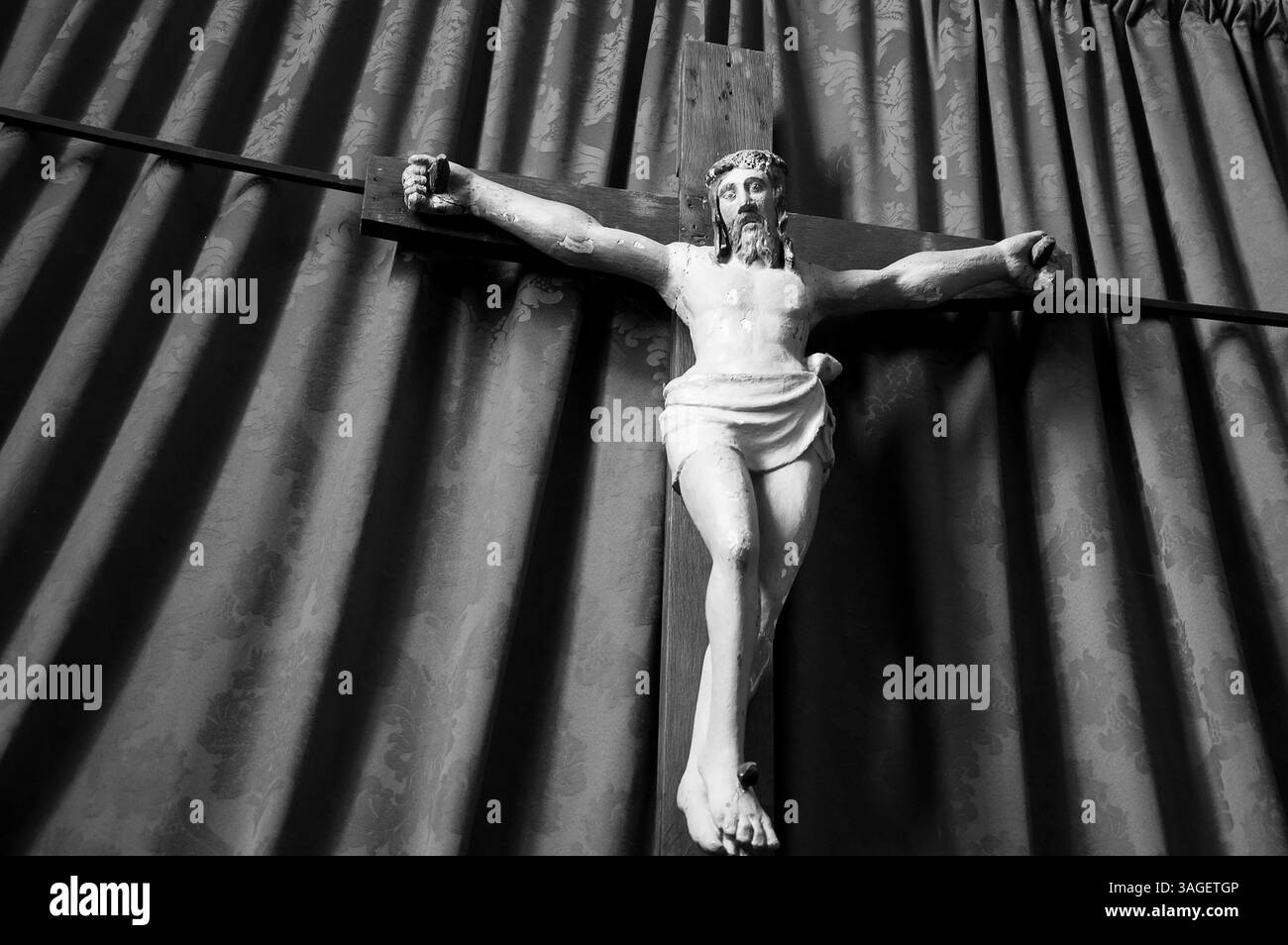 Old wooden crucifix of Jesus Christ isolated on drapery background in ...
