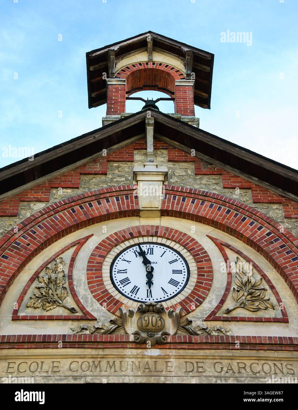 Architectural details of old brick building with bell and clock, former ...