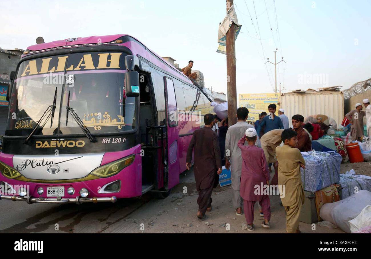 Afghani people are boarding on bus to depart for their homeland ...