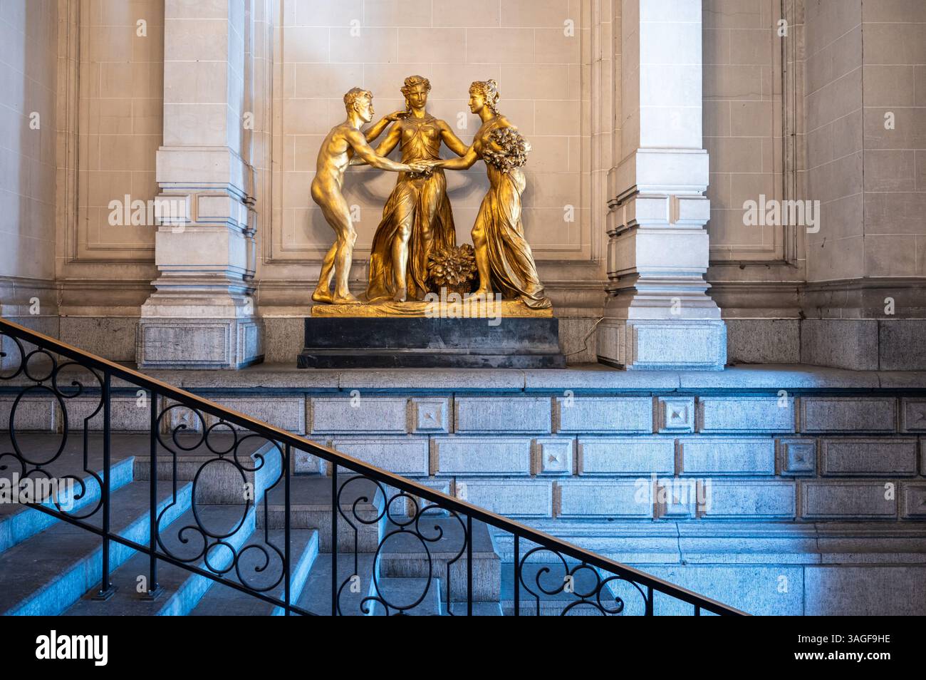 Gold plated statue at the staircase hall of the municipal hall of ...
