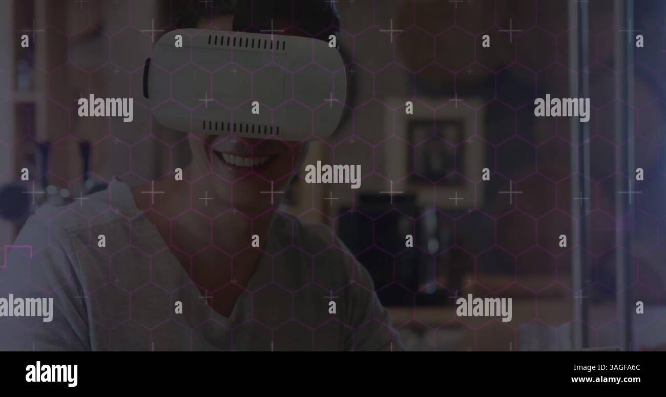 Hexagonal shapes and data processing against caucasian man wearing vr ...