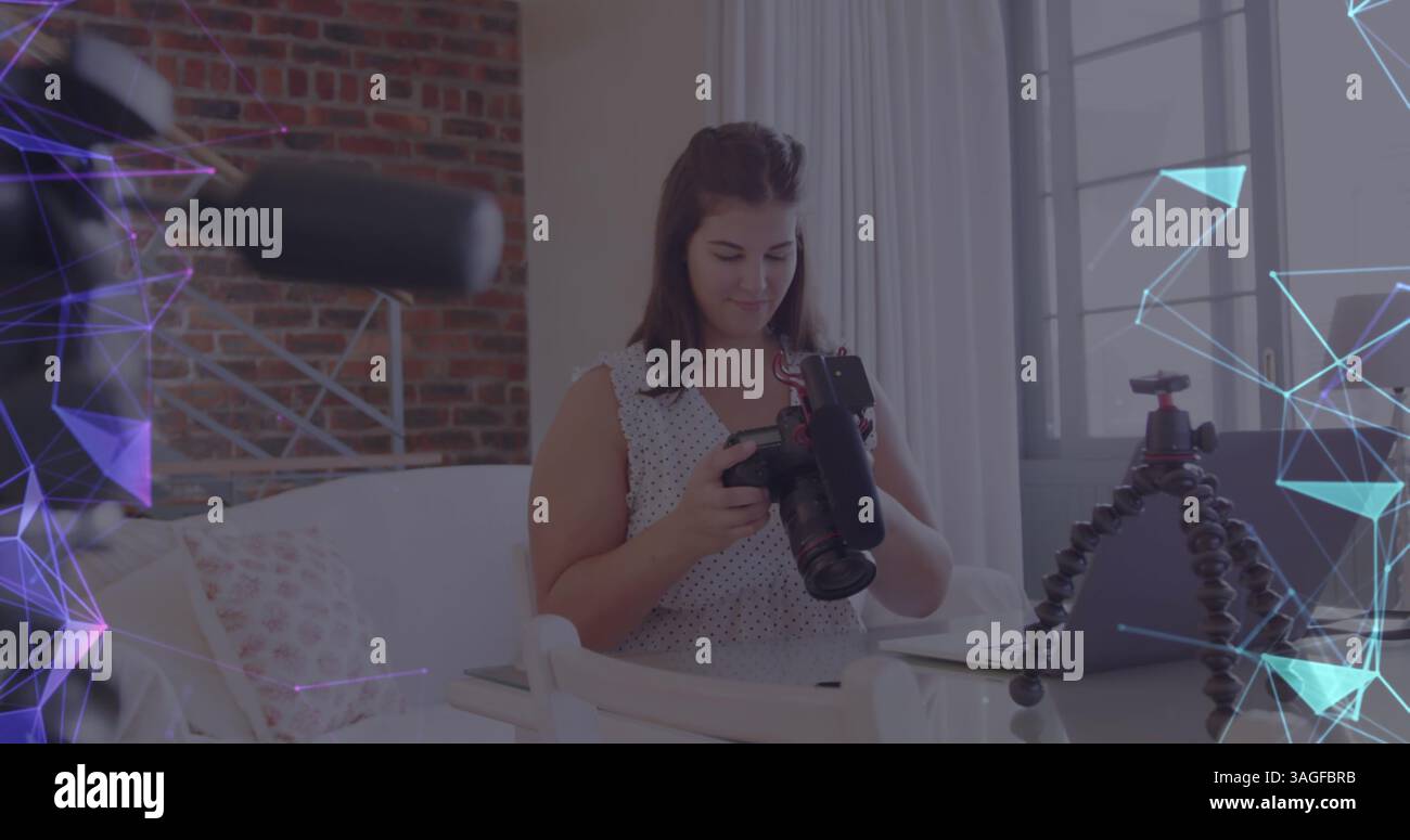 Image of network of connections over female vlogger holding camera ...