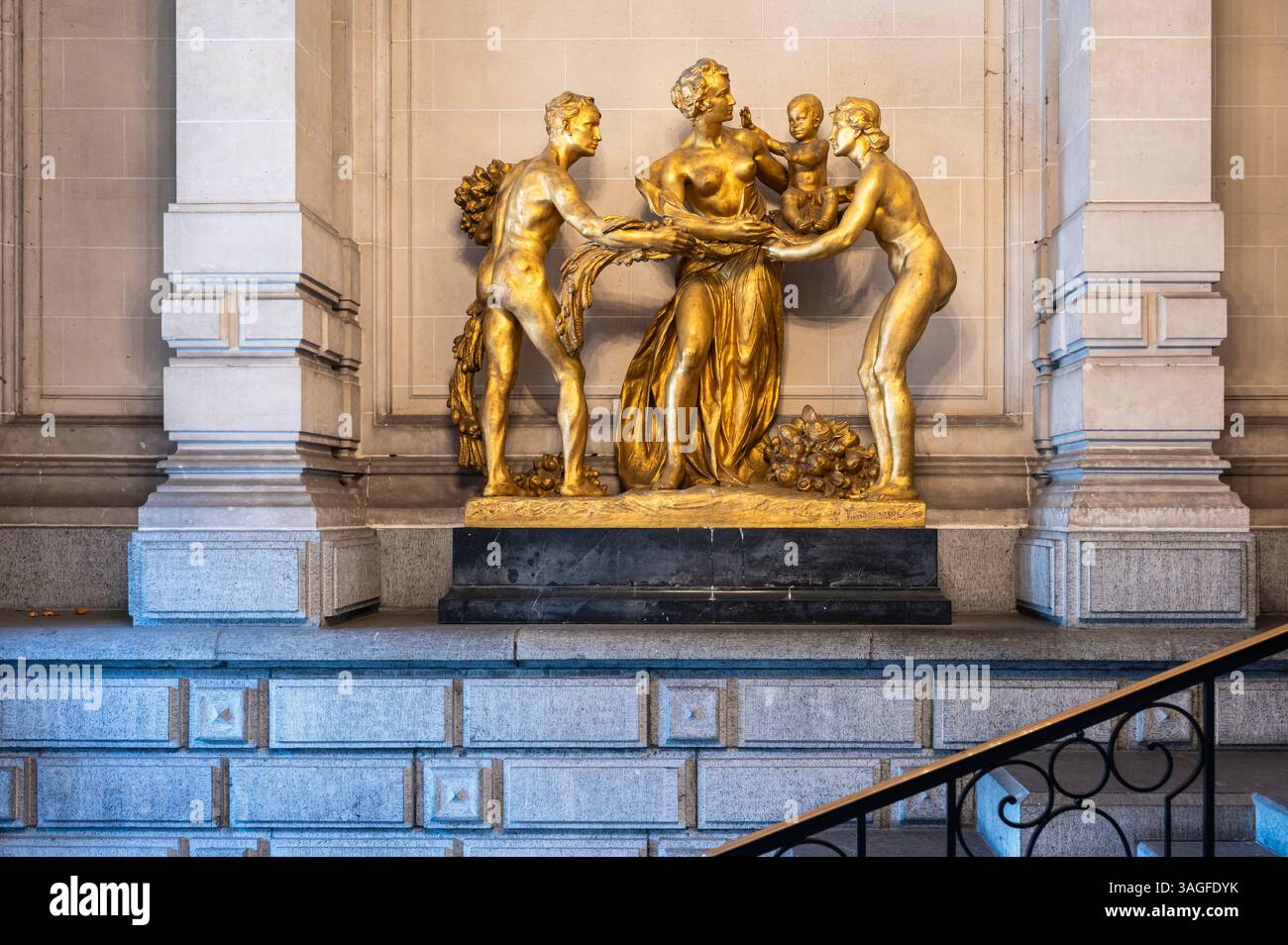 Gold plated statue at the staircase hall of the municipal hall of ...