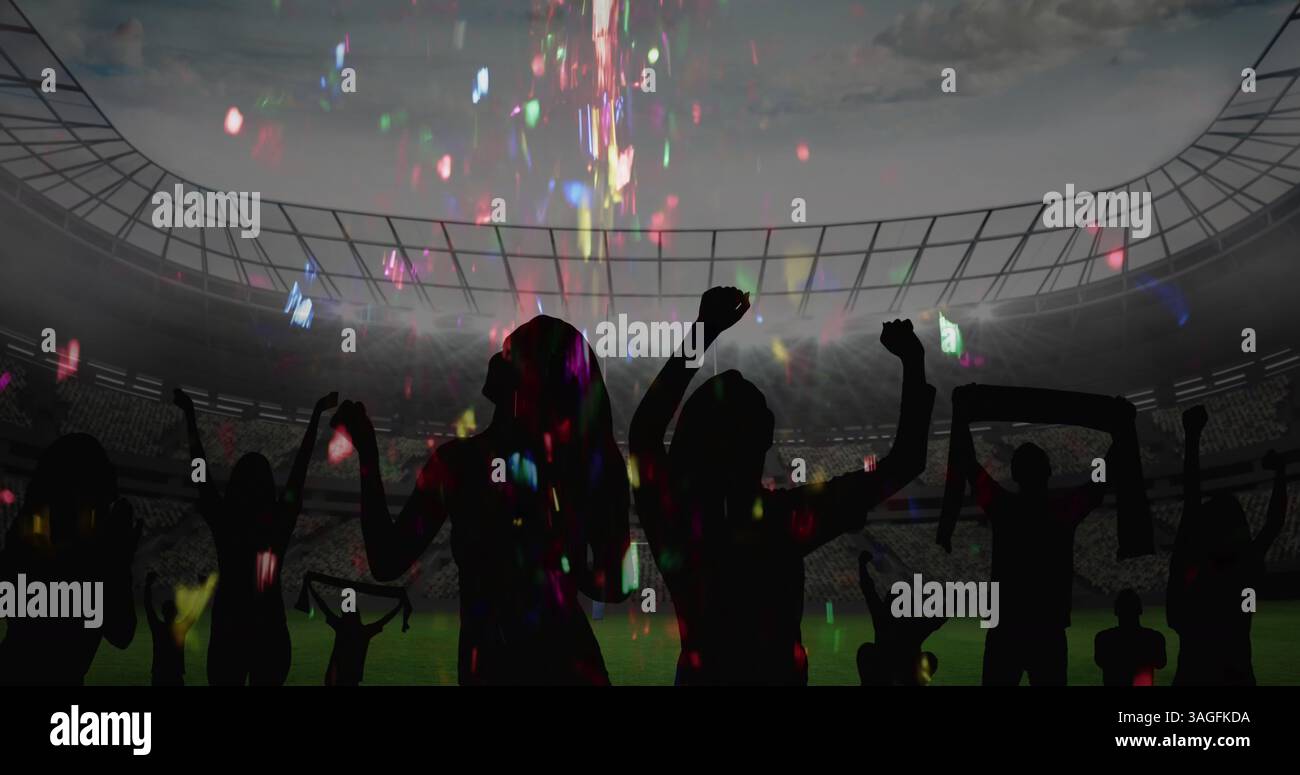Colorful confetti falling over silhouette of fans cheering and sports ...