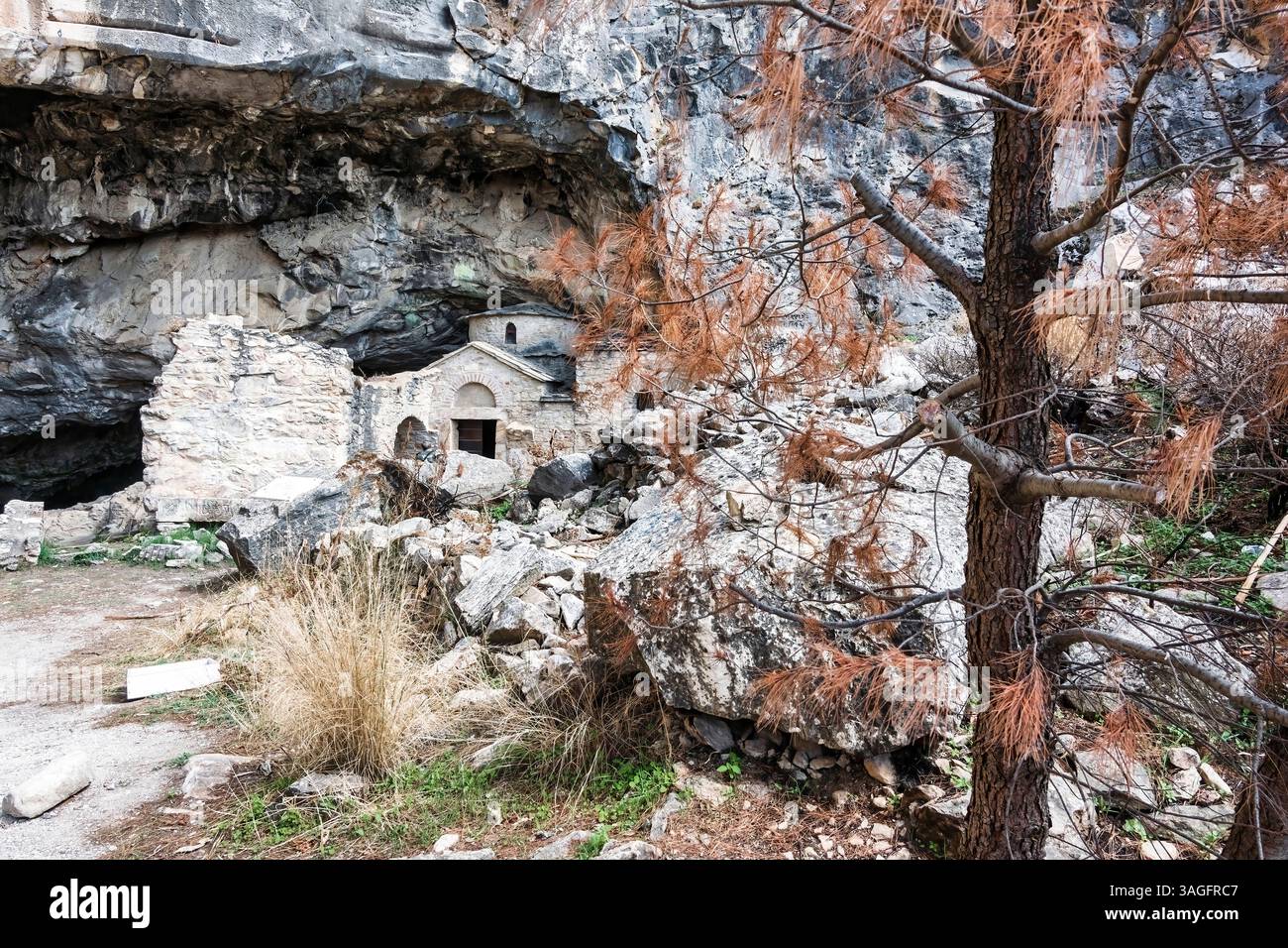 Stone chapel at the entrance of Davelis Cave on Mount Penteli ...