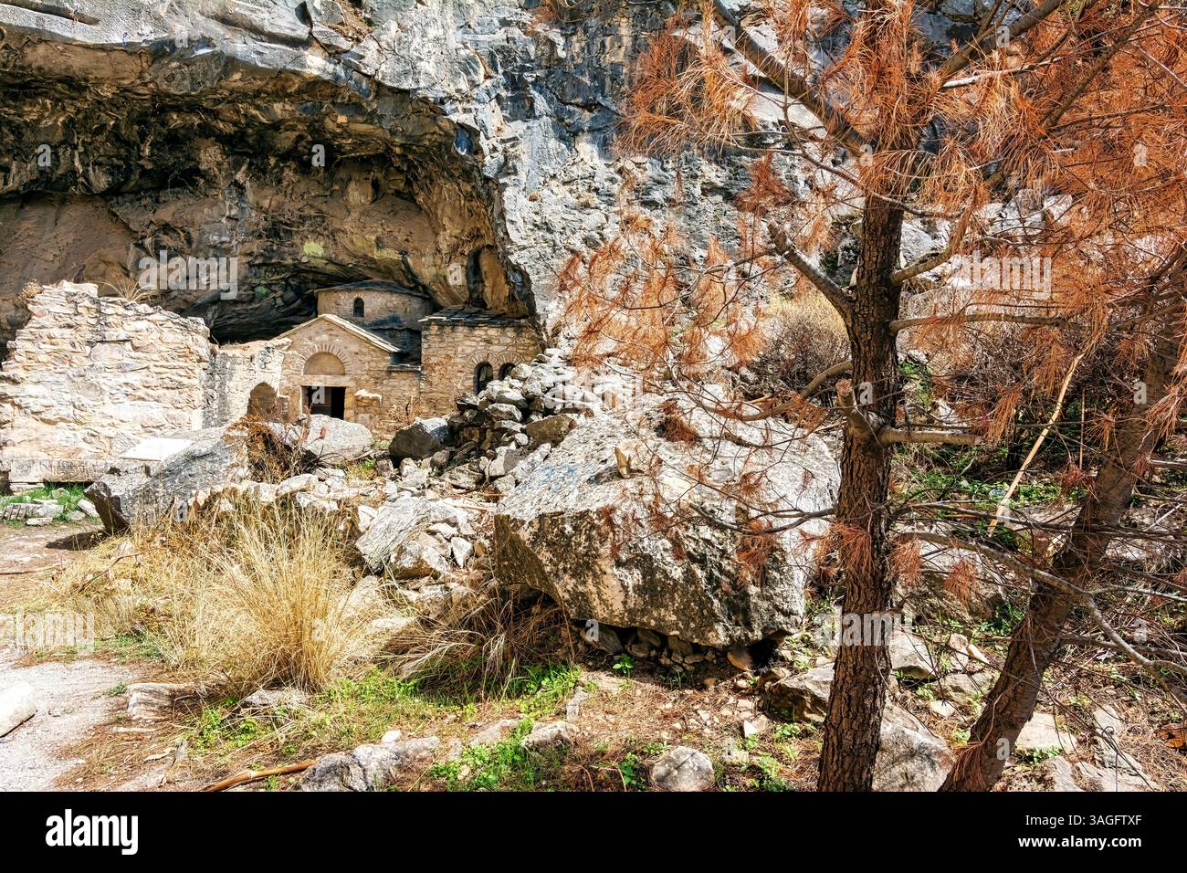 Stone chapel at the entrance of Davelis Cave on Mount Penteli ...
