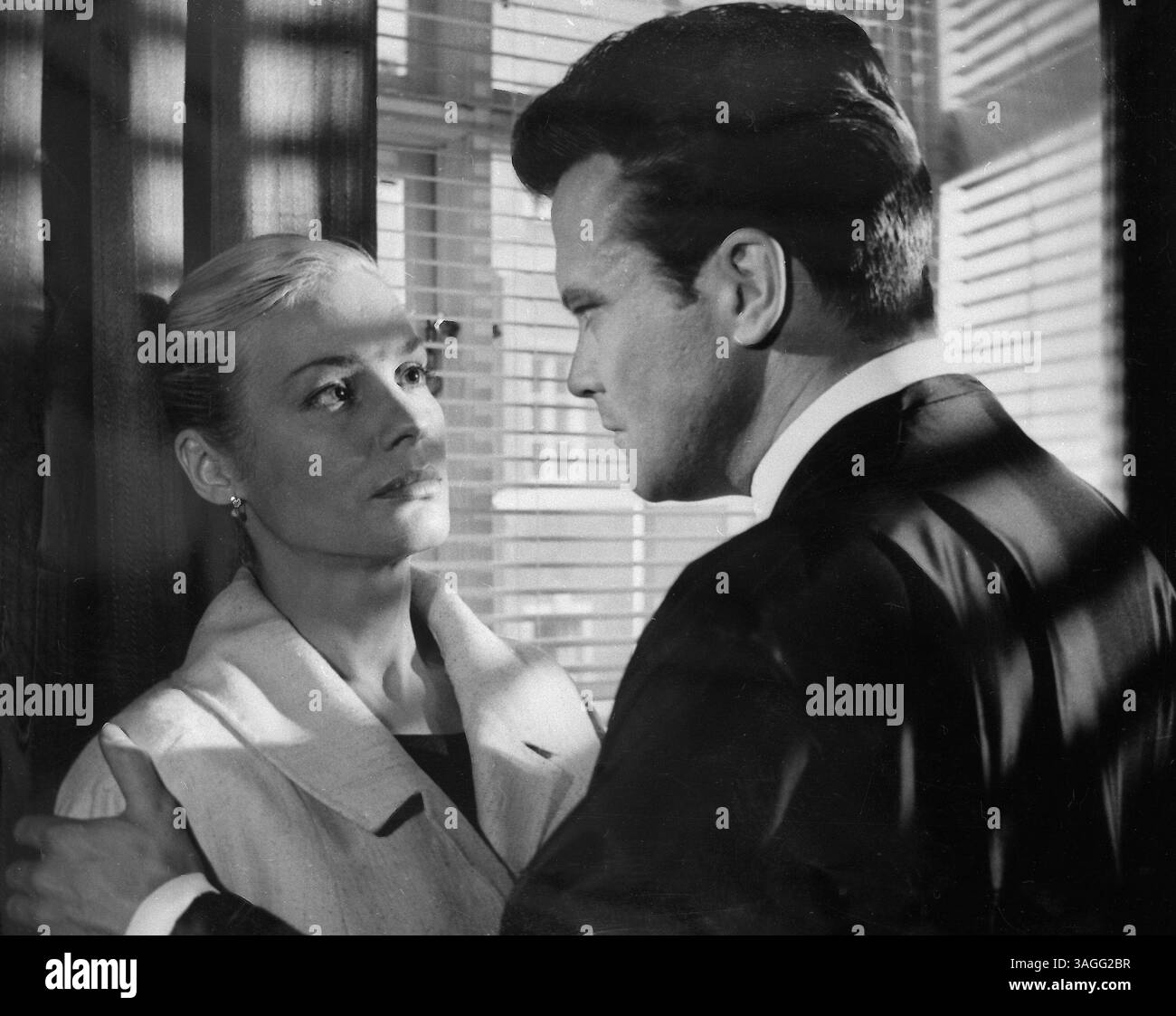 Actors Ingrid Thulin and Gunnar Hellstrom in a scene from the movie The ...