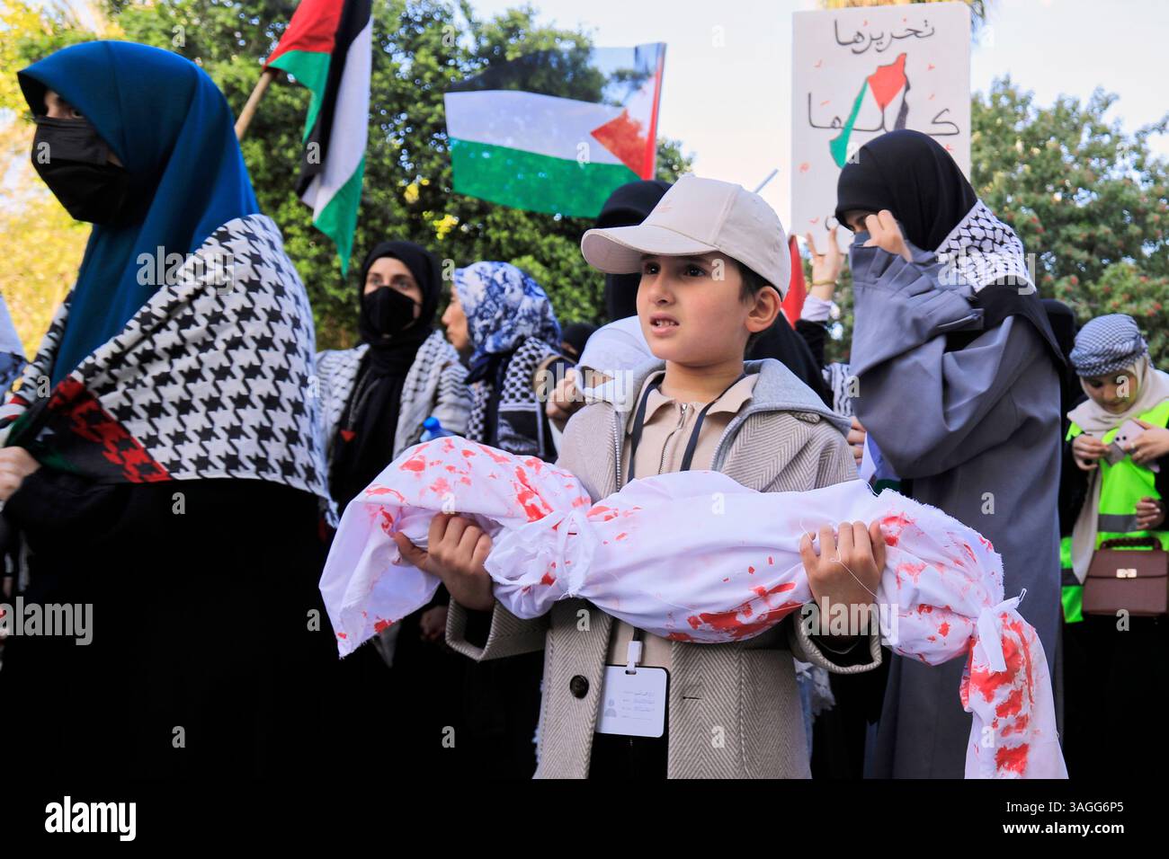 Demonstrators march with props during a rally in support of ...