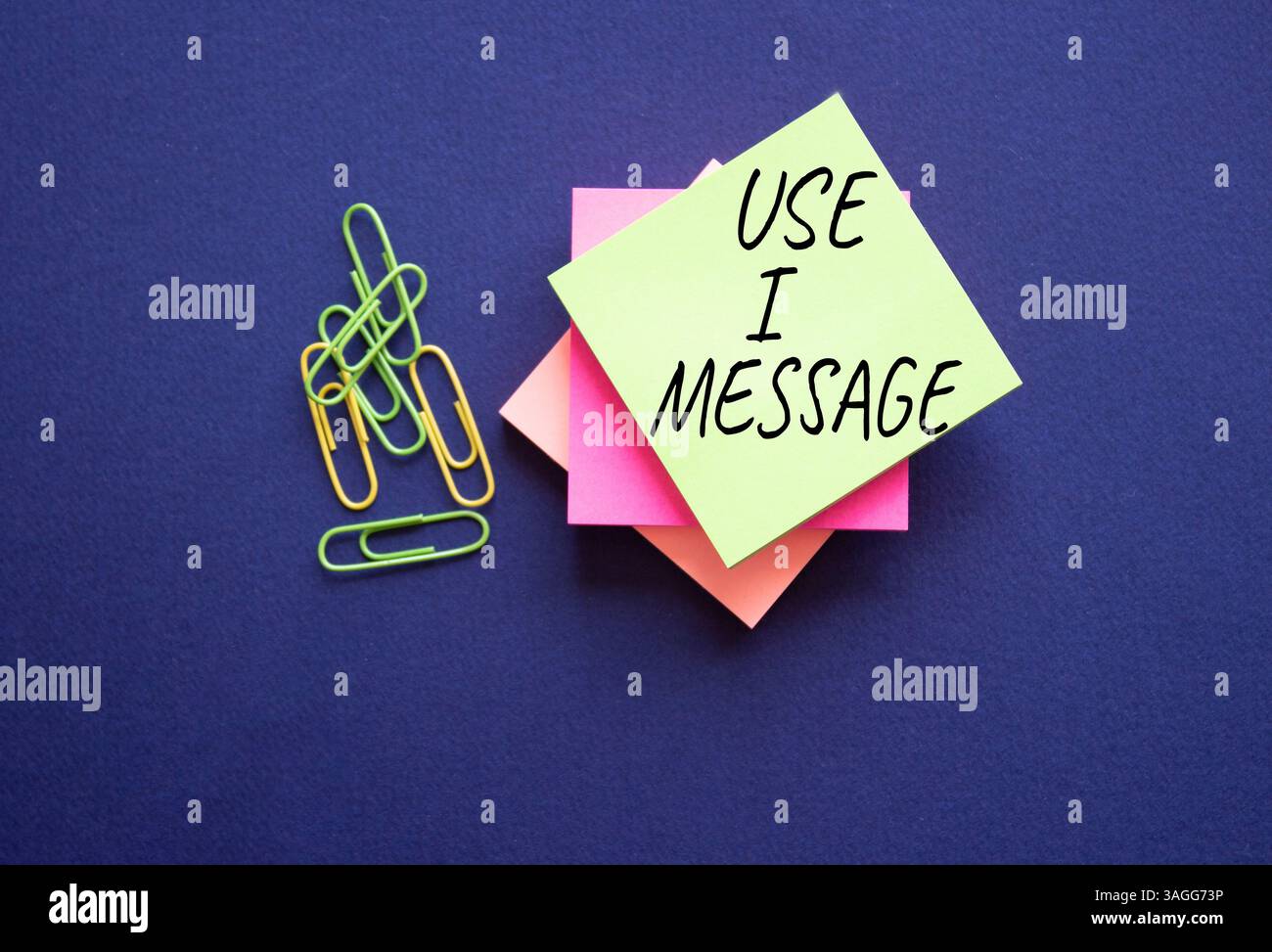 Use I message symbol. Yellow steaky note with paper clips with words ...