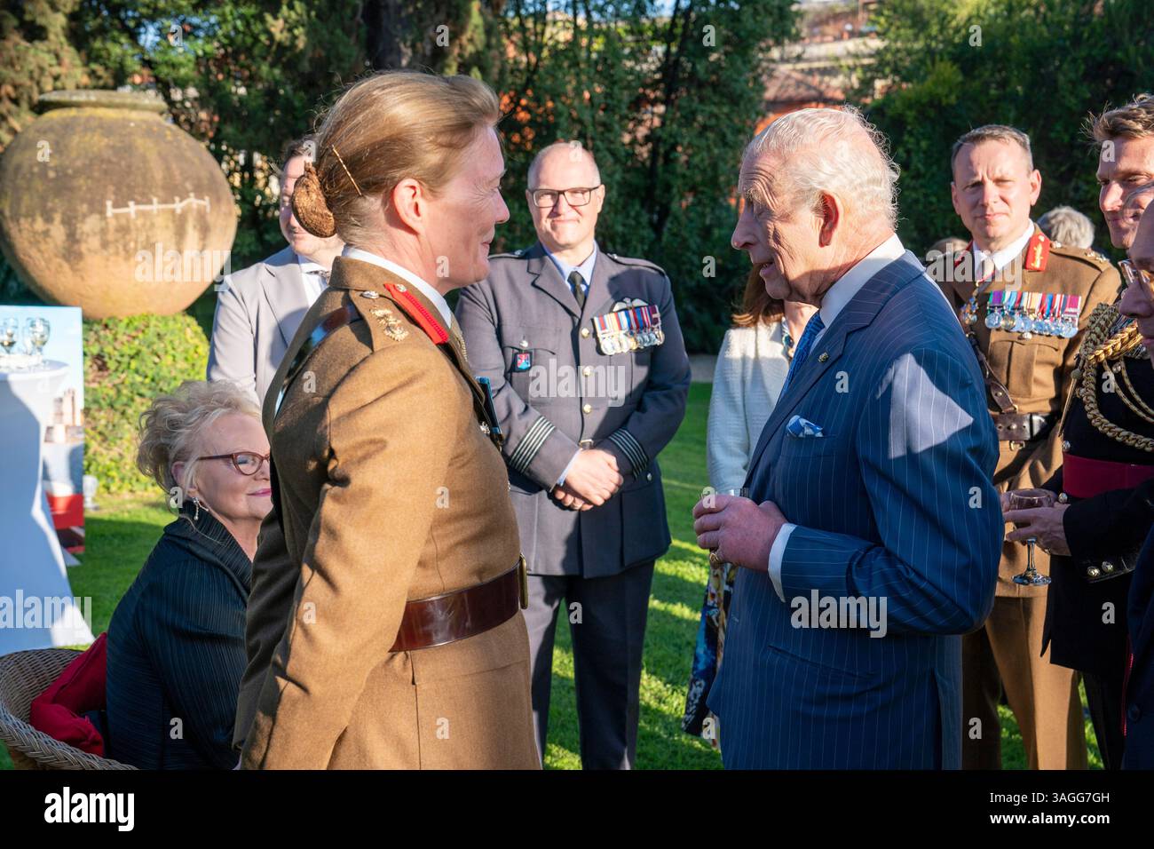 King Charles III speaks with Colonel Erica Bridge during a reception ...