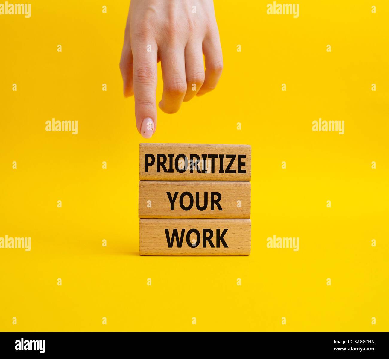 Priority symbol. Wooden blocks with words 'Prioritize your work ...