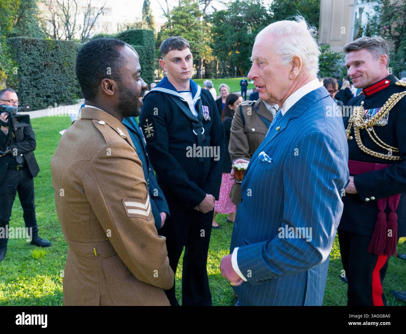 King Charles III speaks with Cpl Bright Asamoah, from Ghana, during a ...