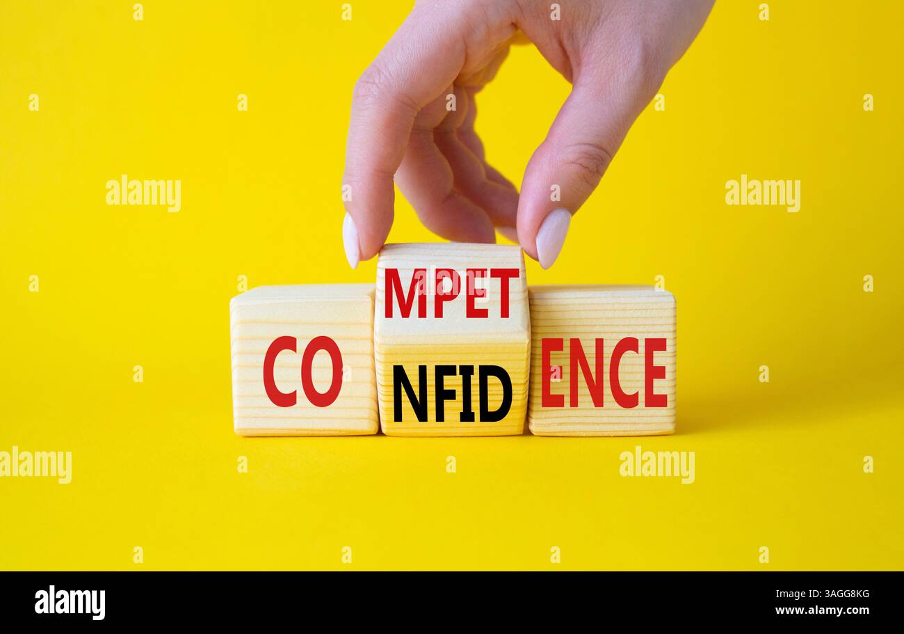 Competence and Confidence symbol. Businessman hand turns wooden cubes ...