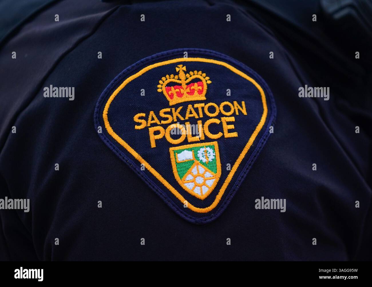 A Saskatoon Police Service badged is shown onto an officers‚Äô uniform ...