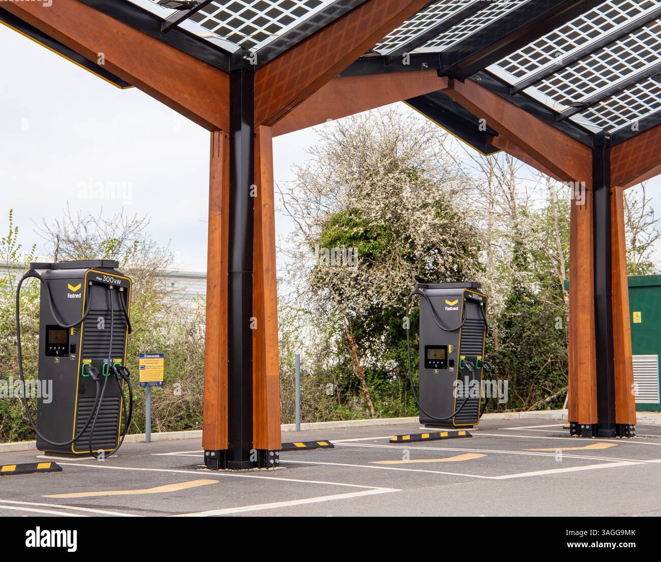 Outdoor charging station with solar canopy over two electric vehicle ...