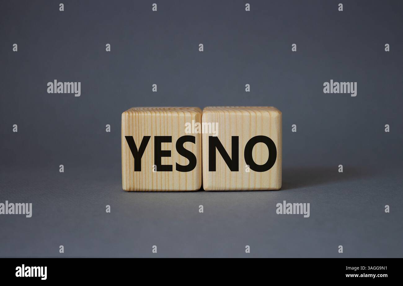Yes vs No symbol. Wooden cubes with words YES and No. Beautiful grey ...