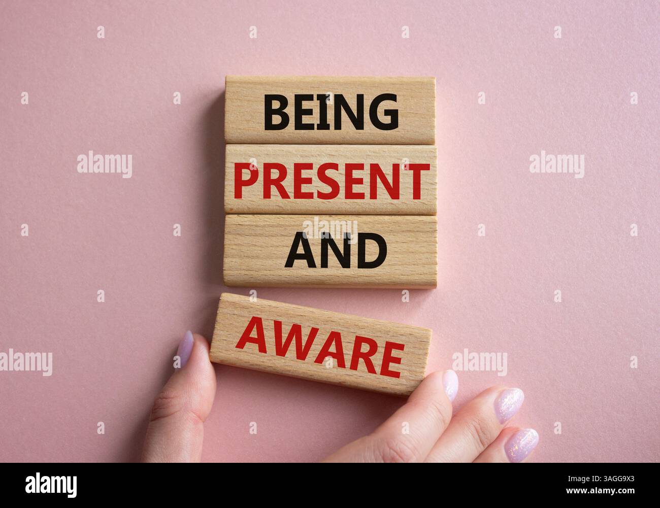 Being Present and Aware symbol. Wooden blocks with words Being Present ...