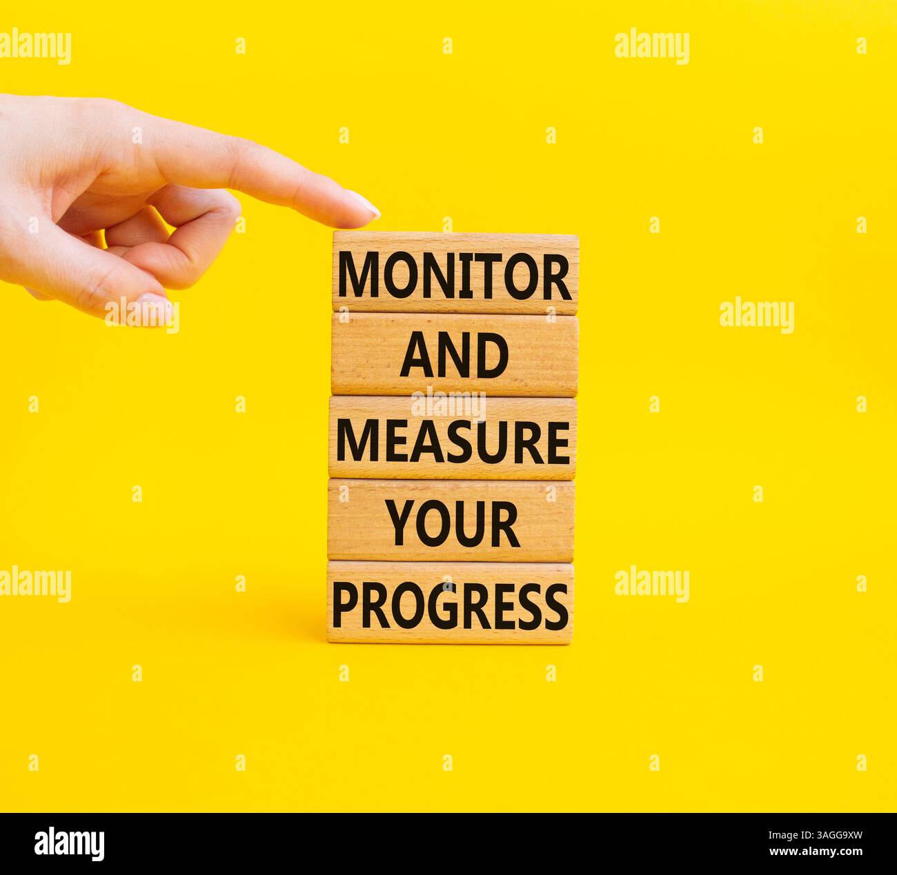 Monitor and Measure your Progress symbol. Wooden blocks with words ...