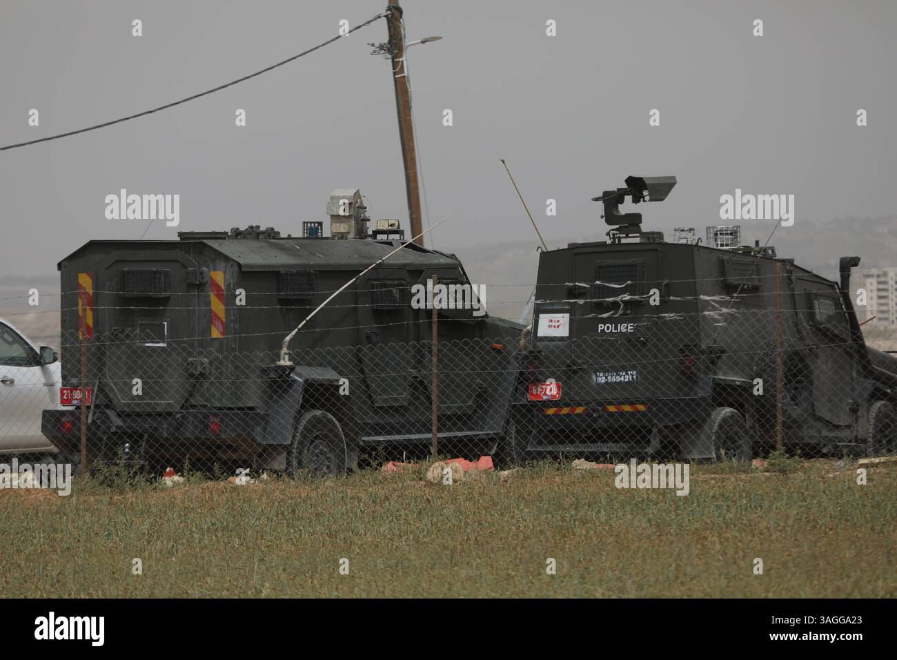 Israeli excavators equipped with breaker tools carry out the demolition ...