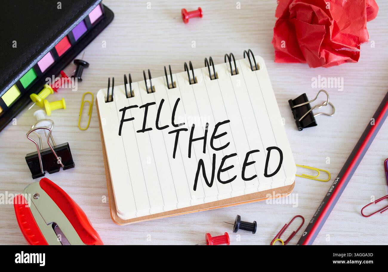Fill the need symbol. Concept word Fill the need on white notebook ...