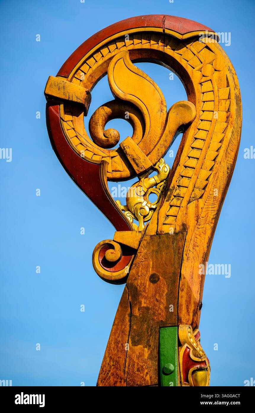 Side view of a carved tail figure on a replica viking ship Stock Photo ...
