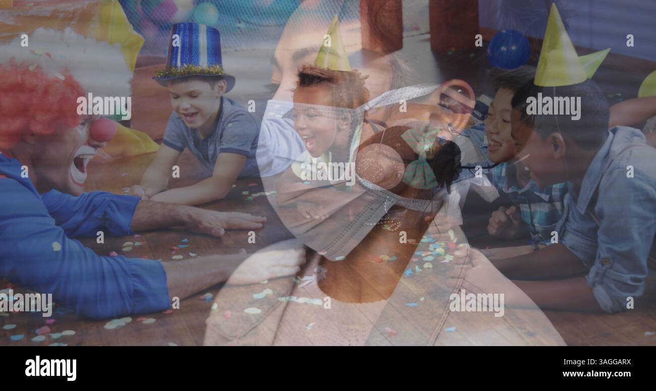 Children wearing party hats laughing with clown at birthday celebration ...